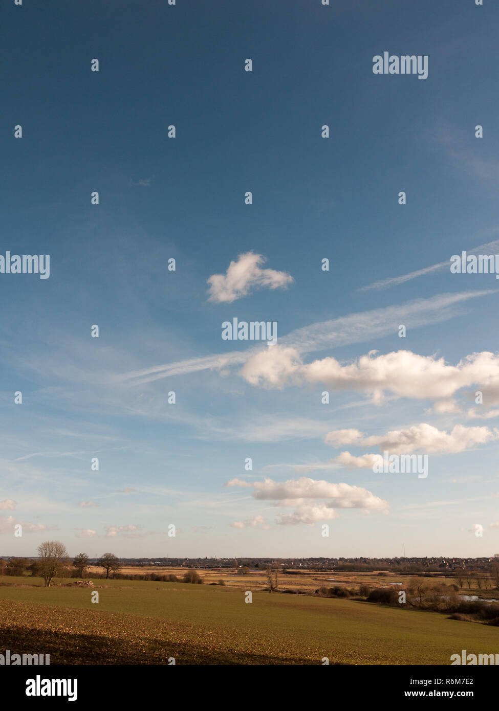 large open grass plain field with blue cloudy sky background nature ...