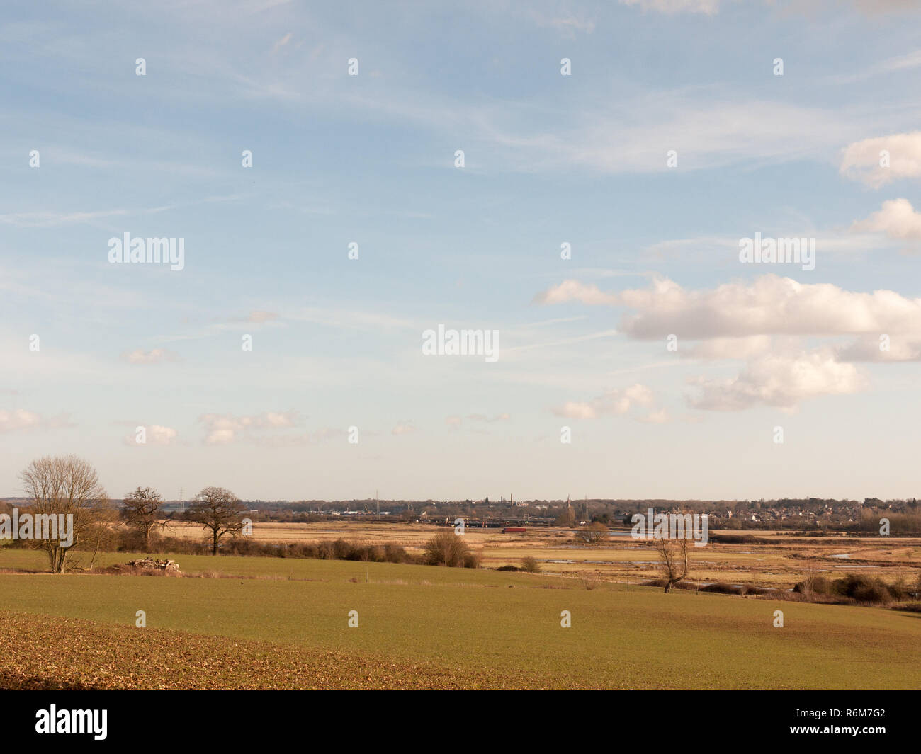 large open grass plain field with blue cloudy sky background nature ...