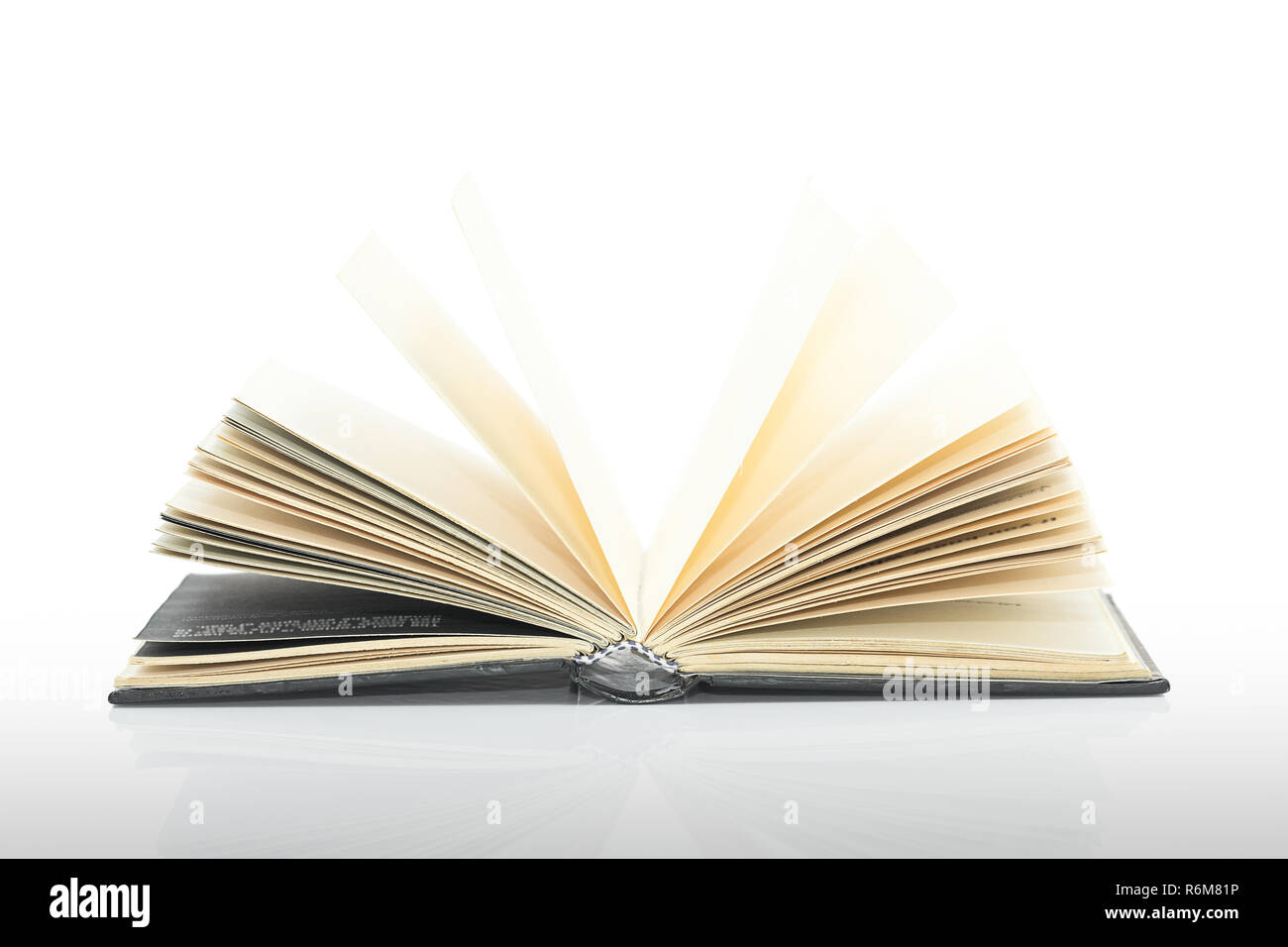Open black book with shadow on white background Stock Photo - Alamy