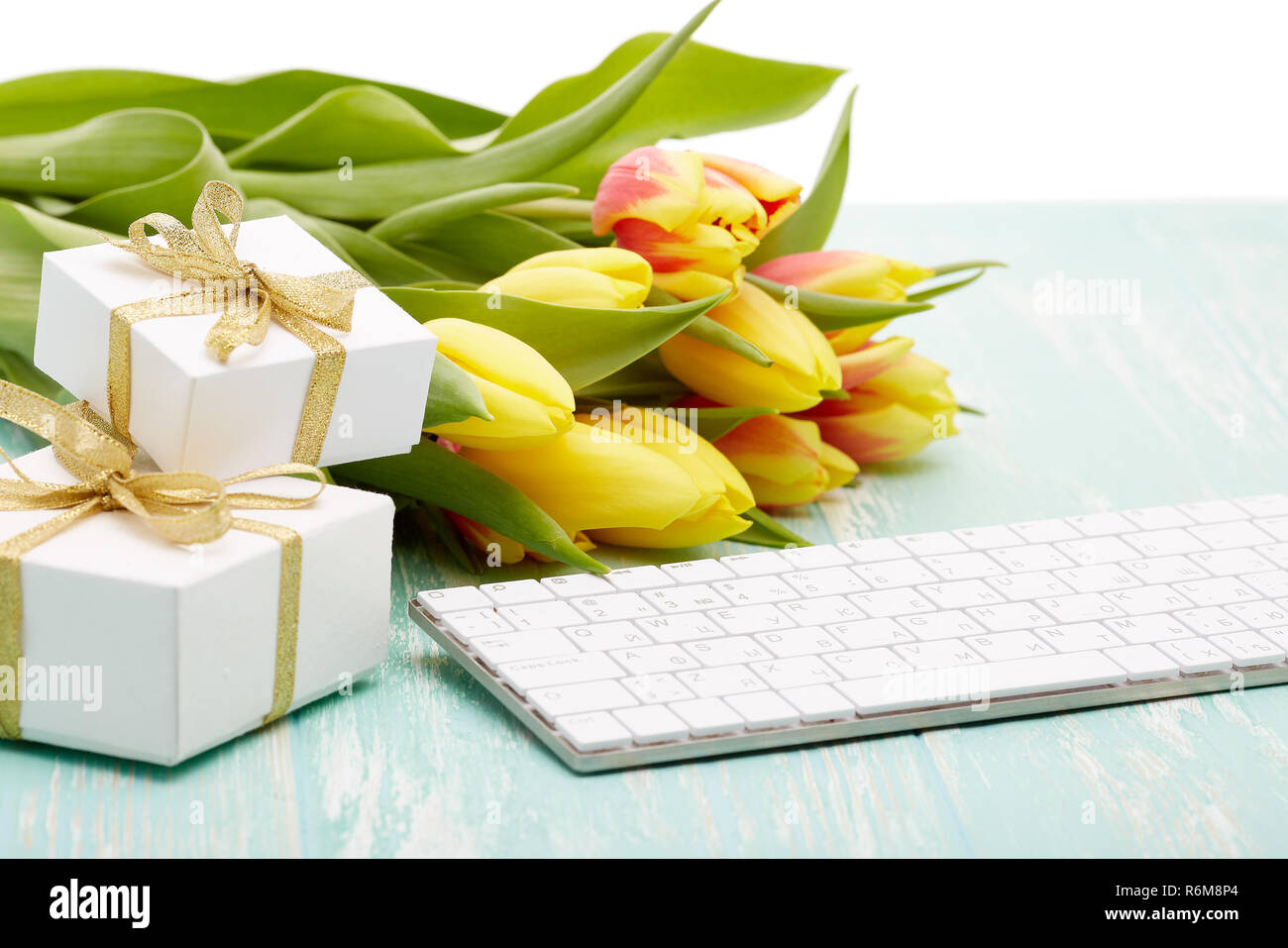 Keyboard, gifts and flowers Stock Photo - Alamy