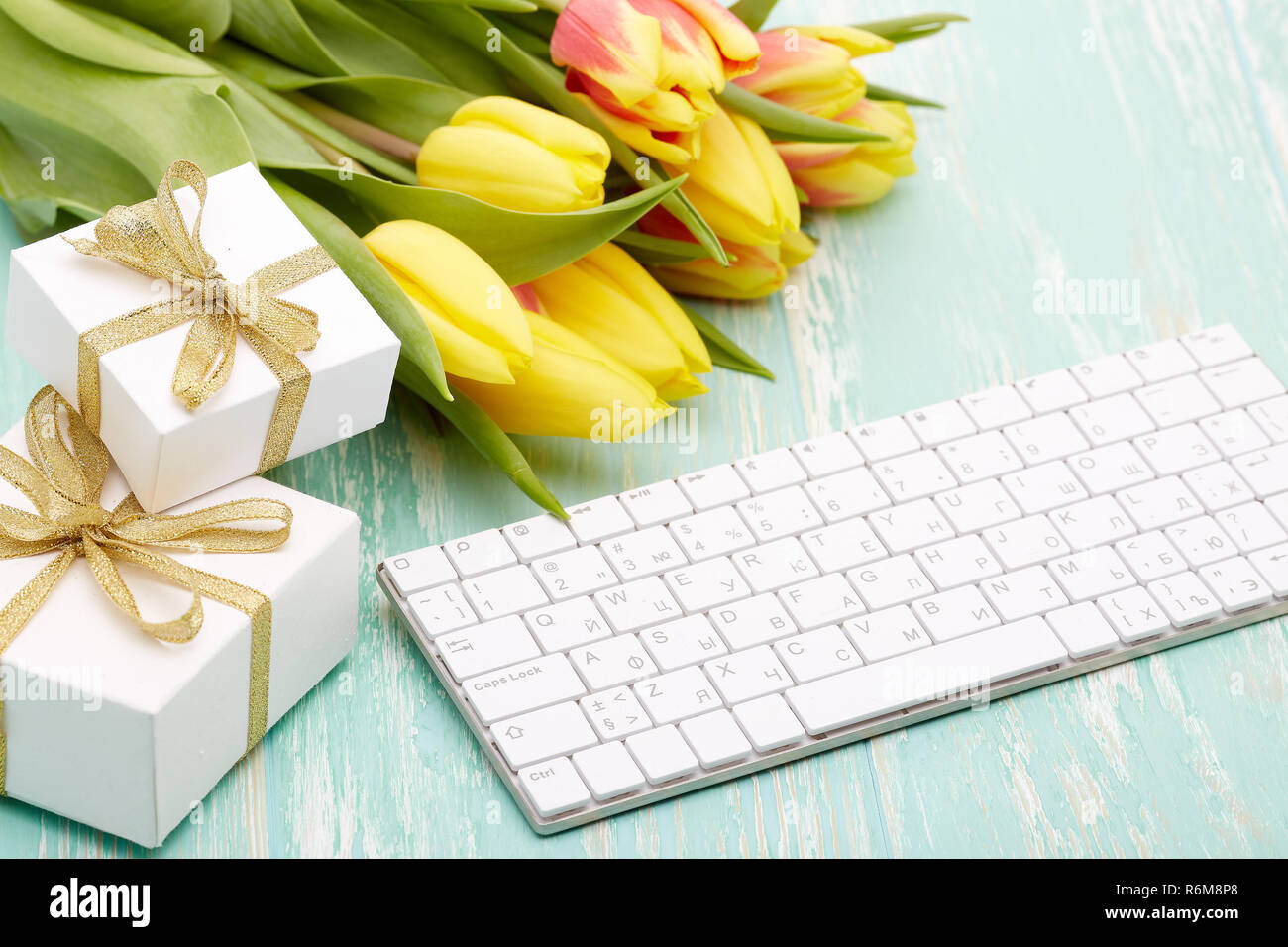 Keyboard, gifts and flowers Stock Photo - Alamy