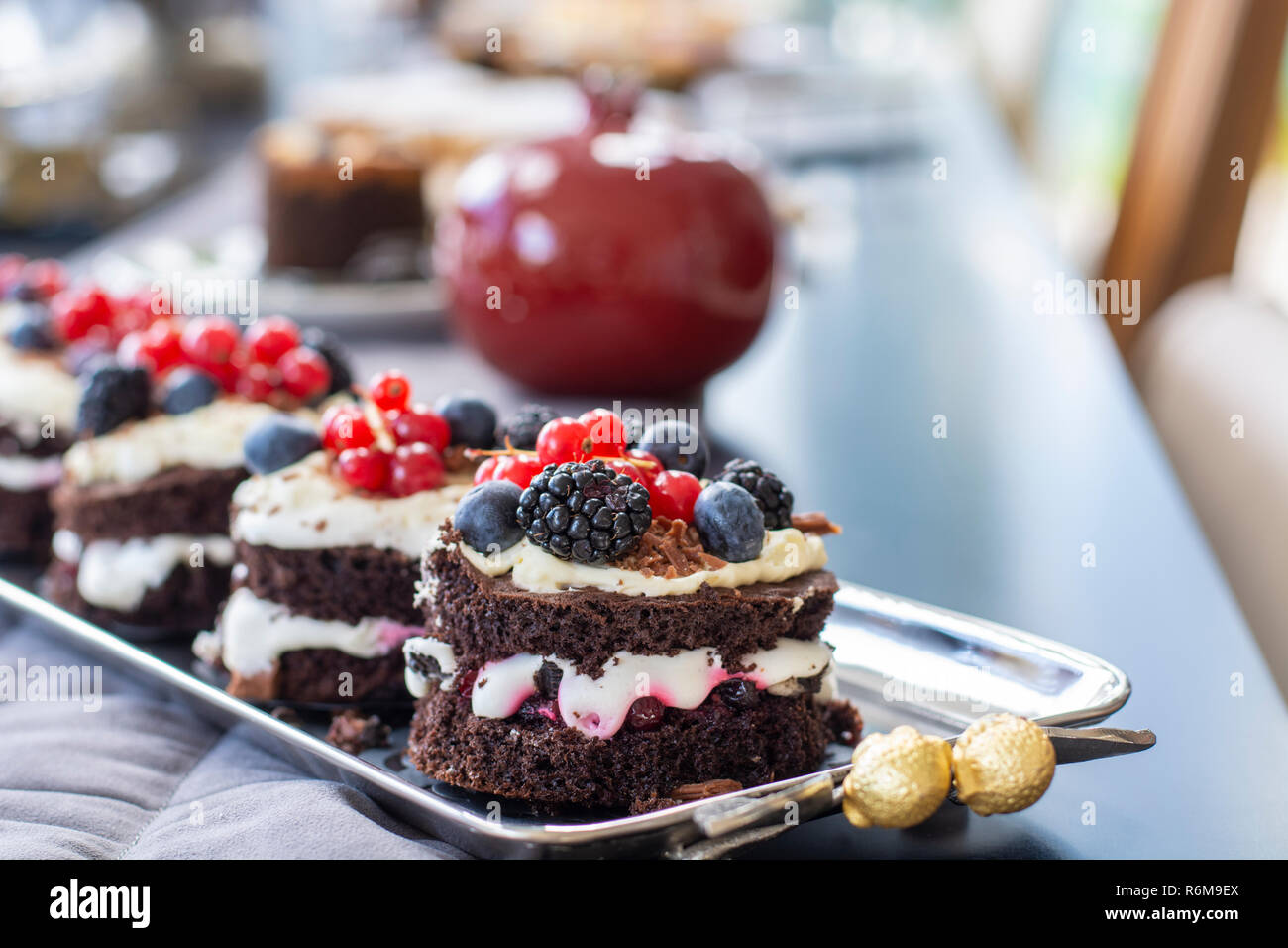 Chocolate cake with mix berries Stock Photo - Alamy