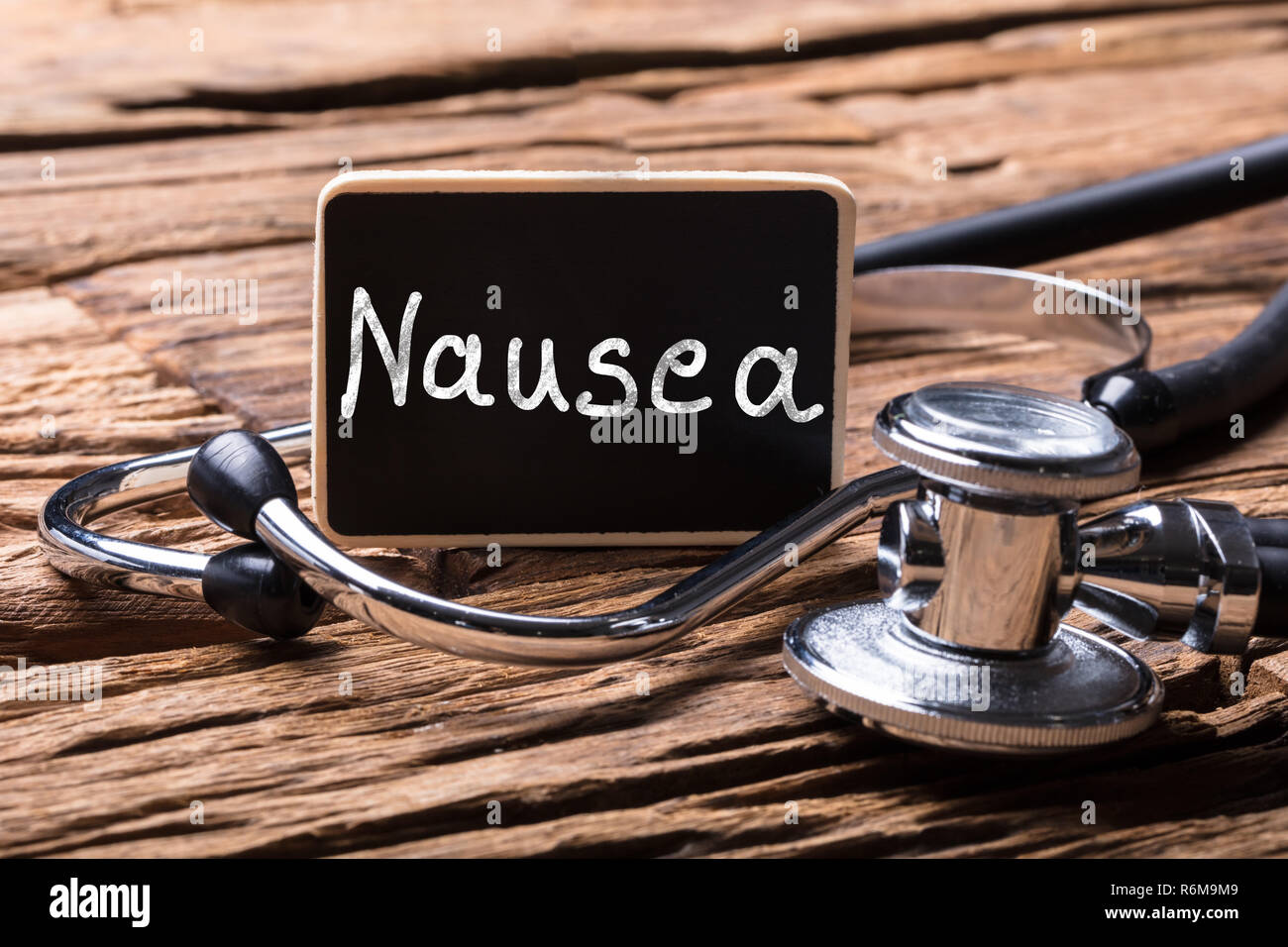 Close-up Of Stethoscope With Slate Showing Nausea Text Stock Photo - Alamy