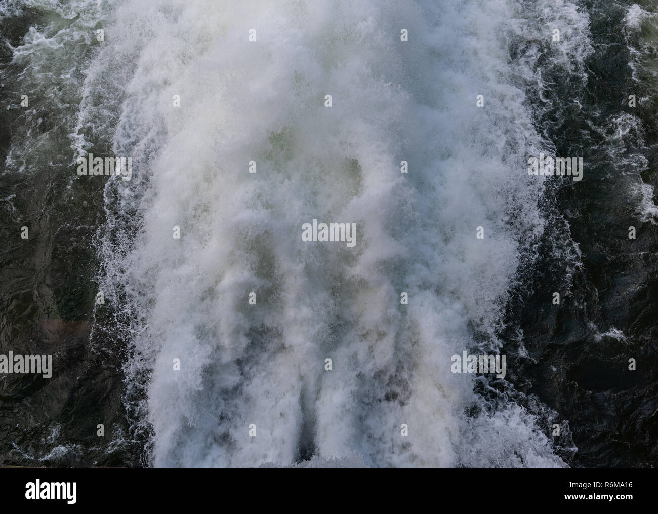 Rushing Water Releases from Dam into River Stock Photo - Alamy