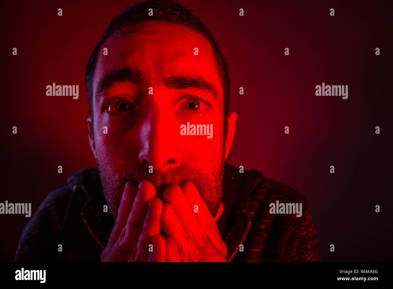 Face hand worry shock frightened hi-res stock photography and images ...