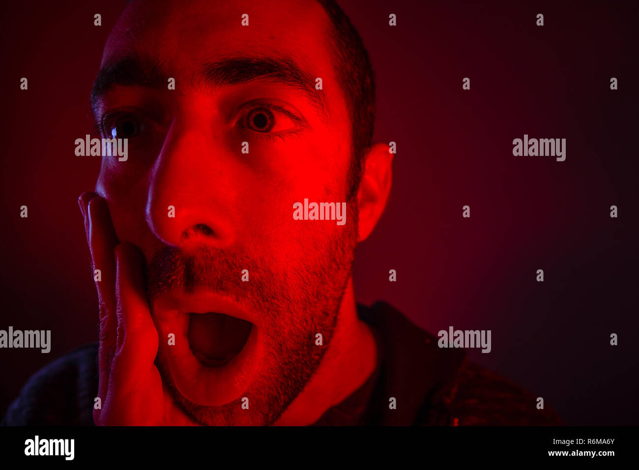 Man with surprised facial expression with opened mouth Stock Photo - Alamy