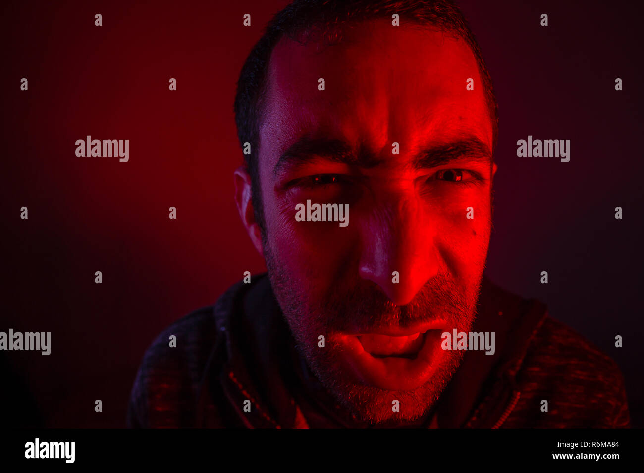 Man with angry facial expression Stock Photo - Alamy