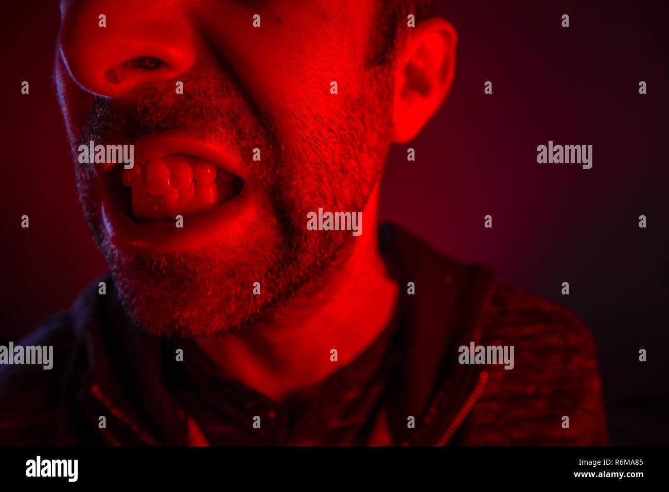 Man with angry facial expression Stock Photo - Alamy