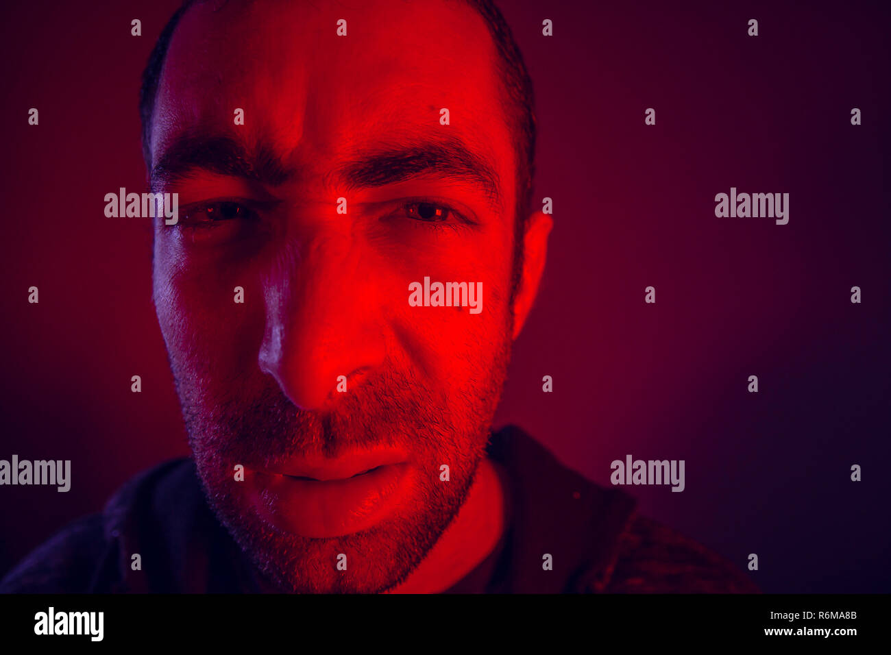 Man with angry facial expression Stock Photo - Alamy