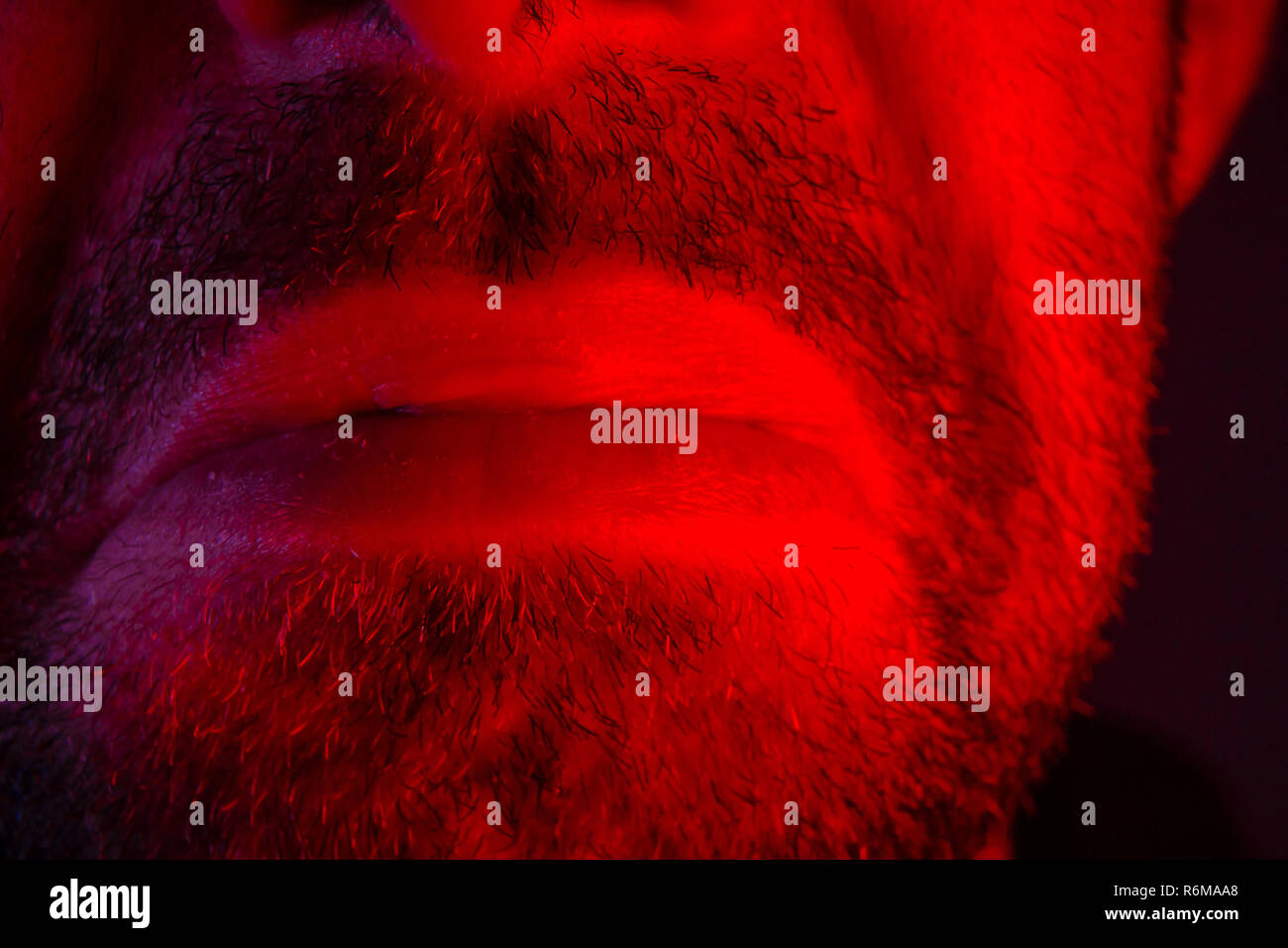 Macro closeup on man lips with sad facial expression Stock Photo - Alamy