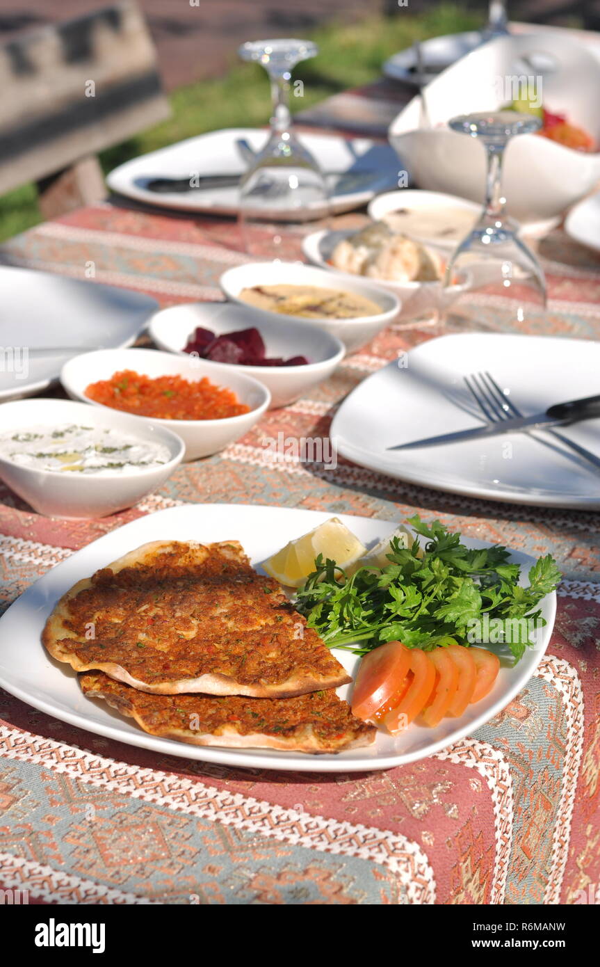 Traditional Cypriot meze and kebap barbecue party in the garden with ...