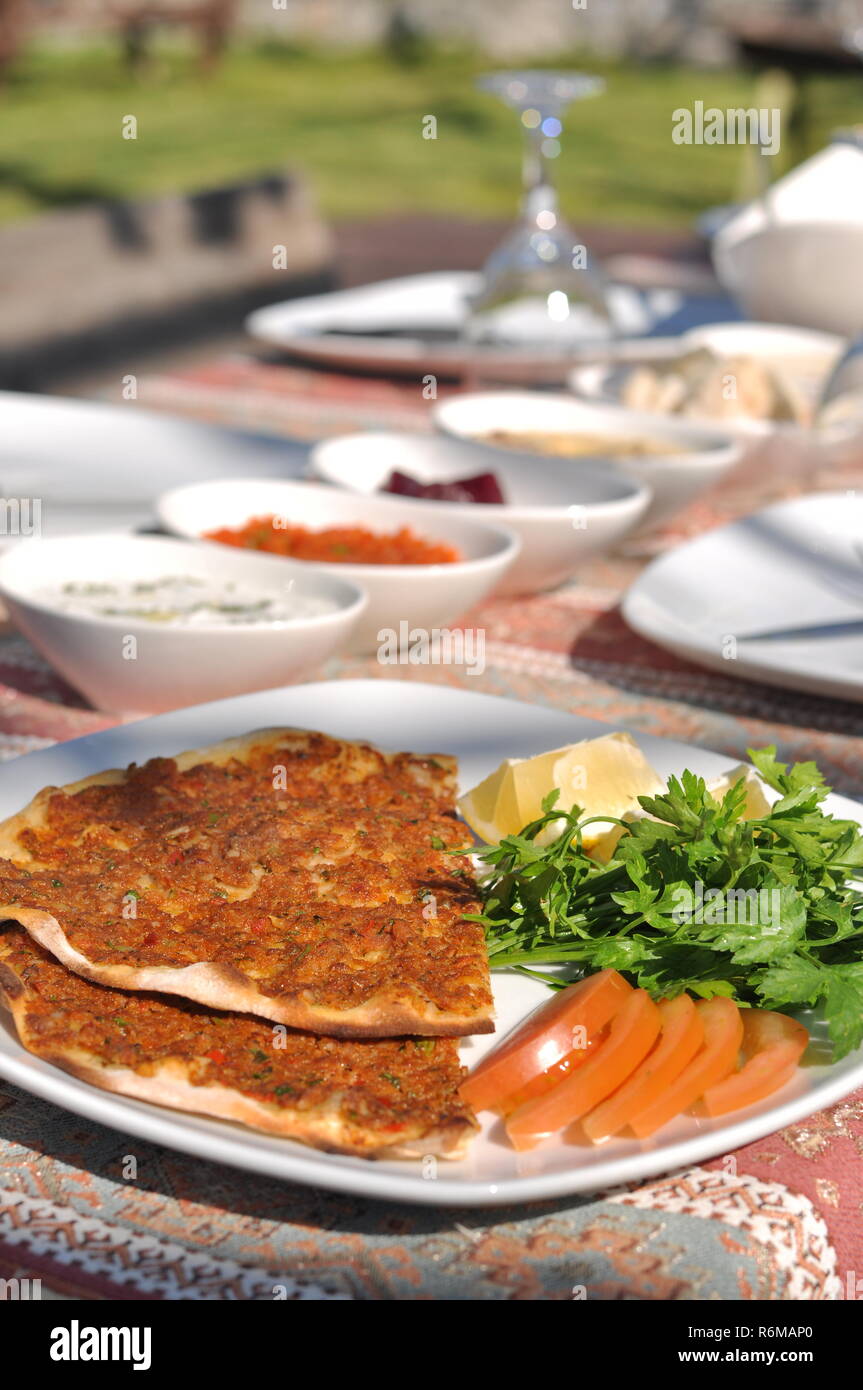 Traditional Cypriot meze and kebap barbecue party in the garden with ...