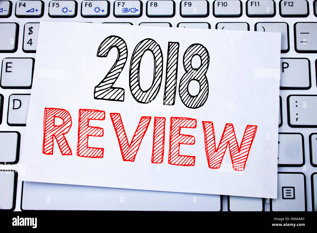 Handwritten text caption showing 2018 Review. Business concept writing ...
