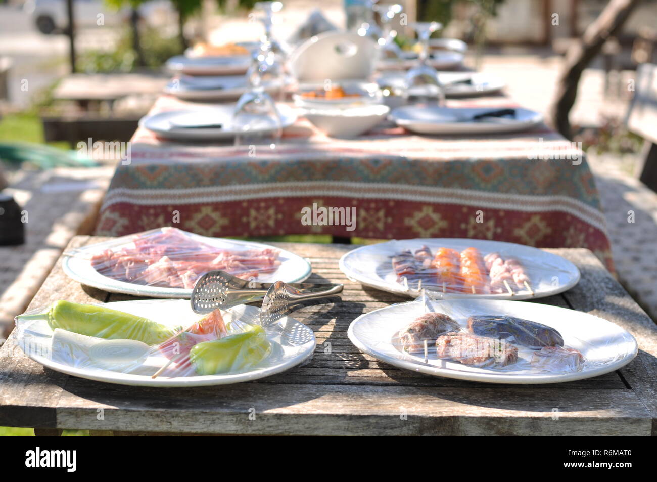 Traditional Cypriot meze and kebap barbecue party in the garden with ...