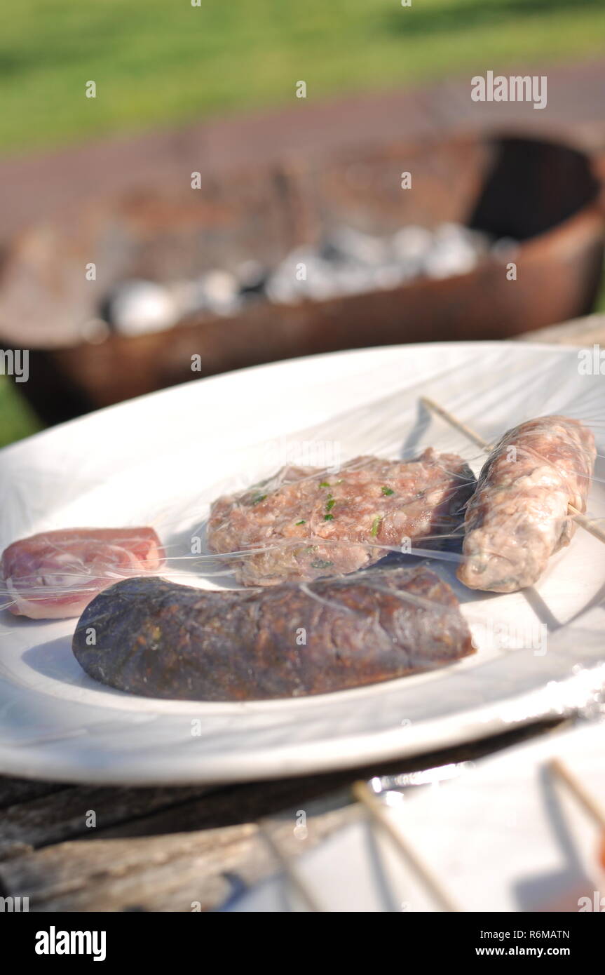 Traditional Cypriot meze and kebap barbecue party in the garden with ...