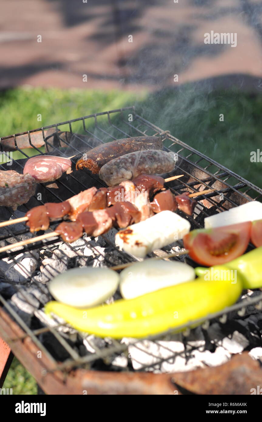 Traditional Cypriot meze and kebap barbecue party in the garden with ...