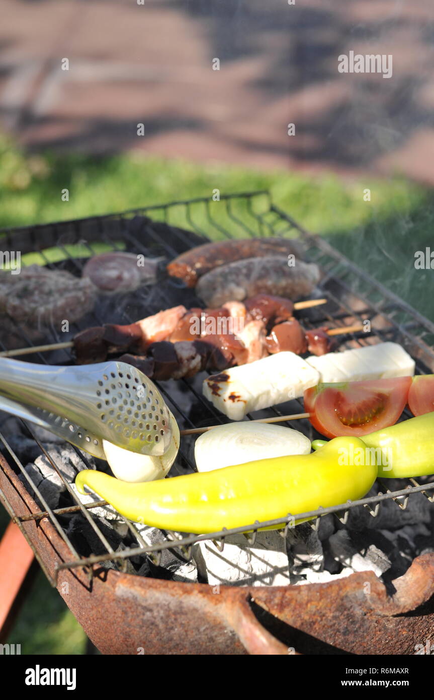 Traditional Cypriot meze and kebap barbecue party in the garden with ...