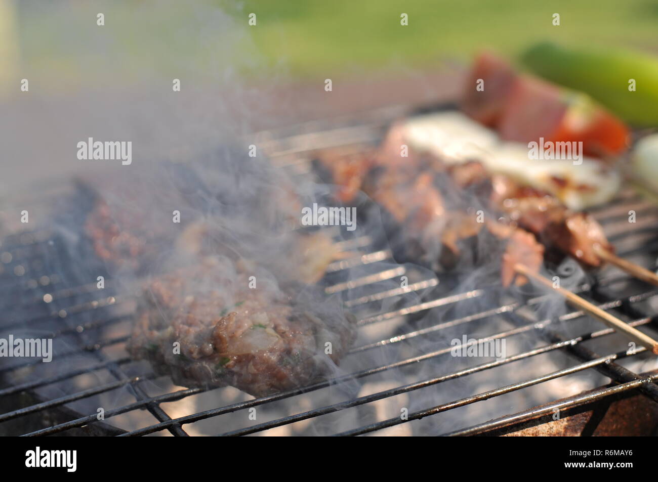 Traditional Cypriot meze and kebap barbecue party in the garden with ...