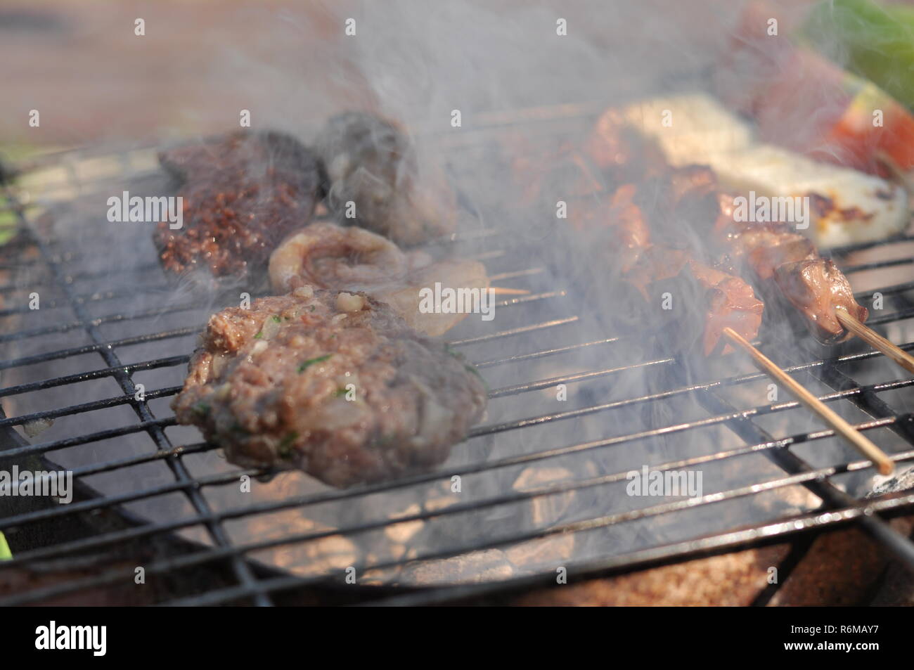 Traditional Cypriot meze and kebap barbecue party in the garden with ...