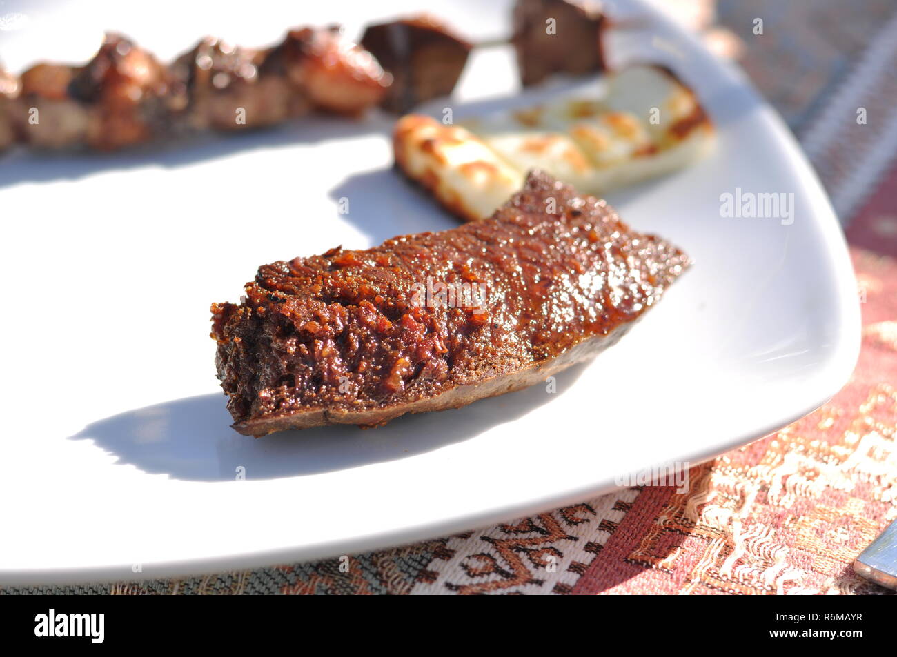 Traditional Cypriot meze and kebap barbecue party in the garden with ...
