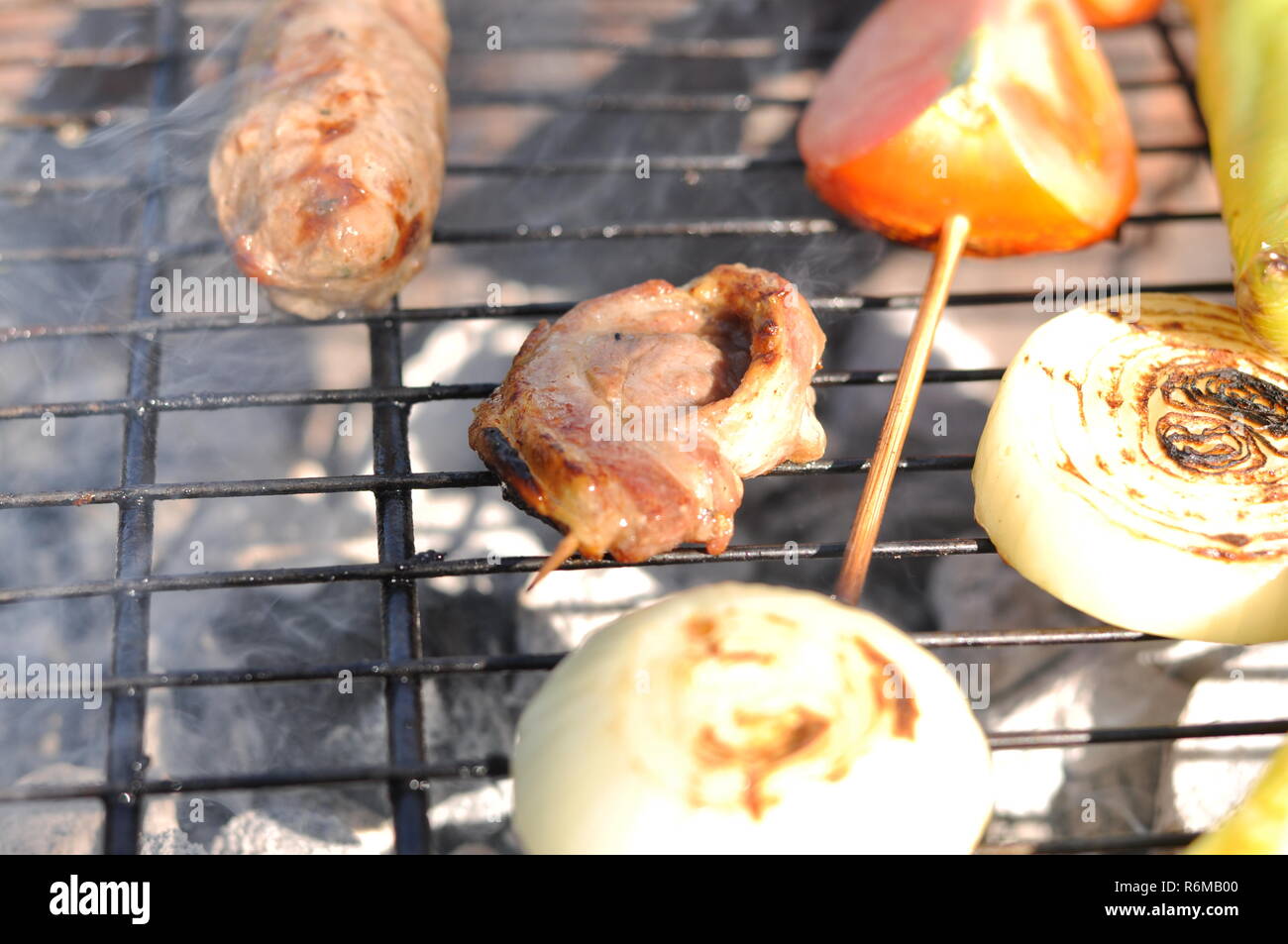 Traditional Cypriot meze and kebap barbecue party in the garden with ...