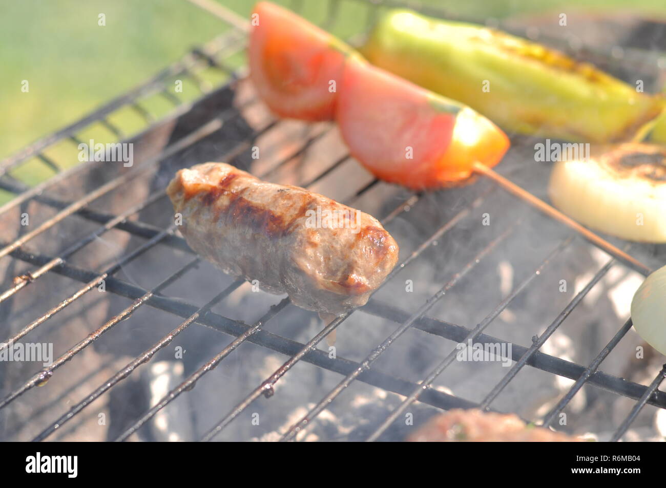 Traditional Cypriot meze and kebap barbecue party in the garden with ...