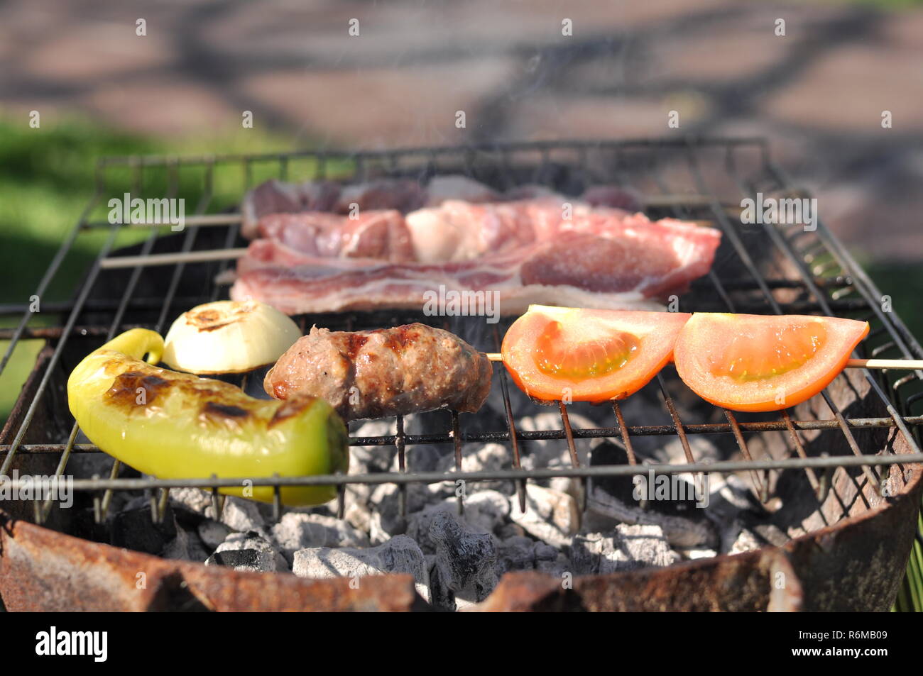Traditional Cypriot meze and kebap barbecue party in the garden with ...