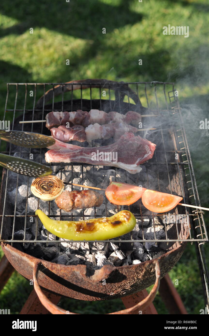 Traditional Cypriot meze and kebap barbecue party in the garden with ...