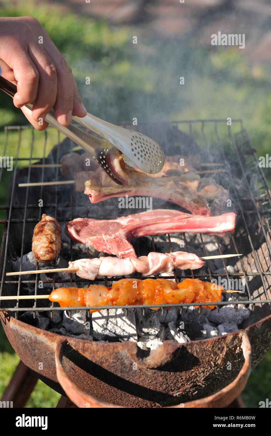 Traditional Cypriot meze and kebap barbecue party in the garden with ...