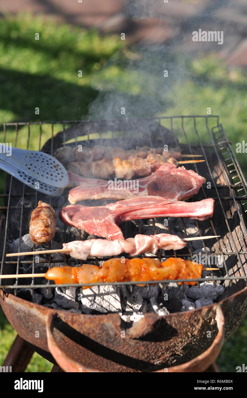 Traditional Cypriot meze and kebap barbecue party in the garden with ...