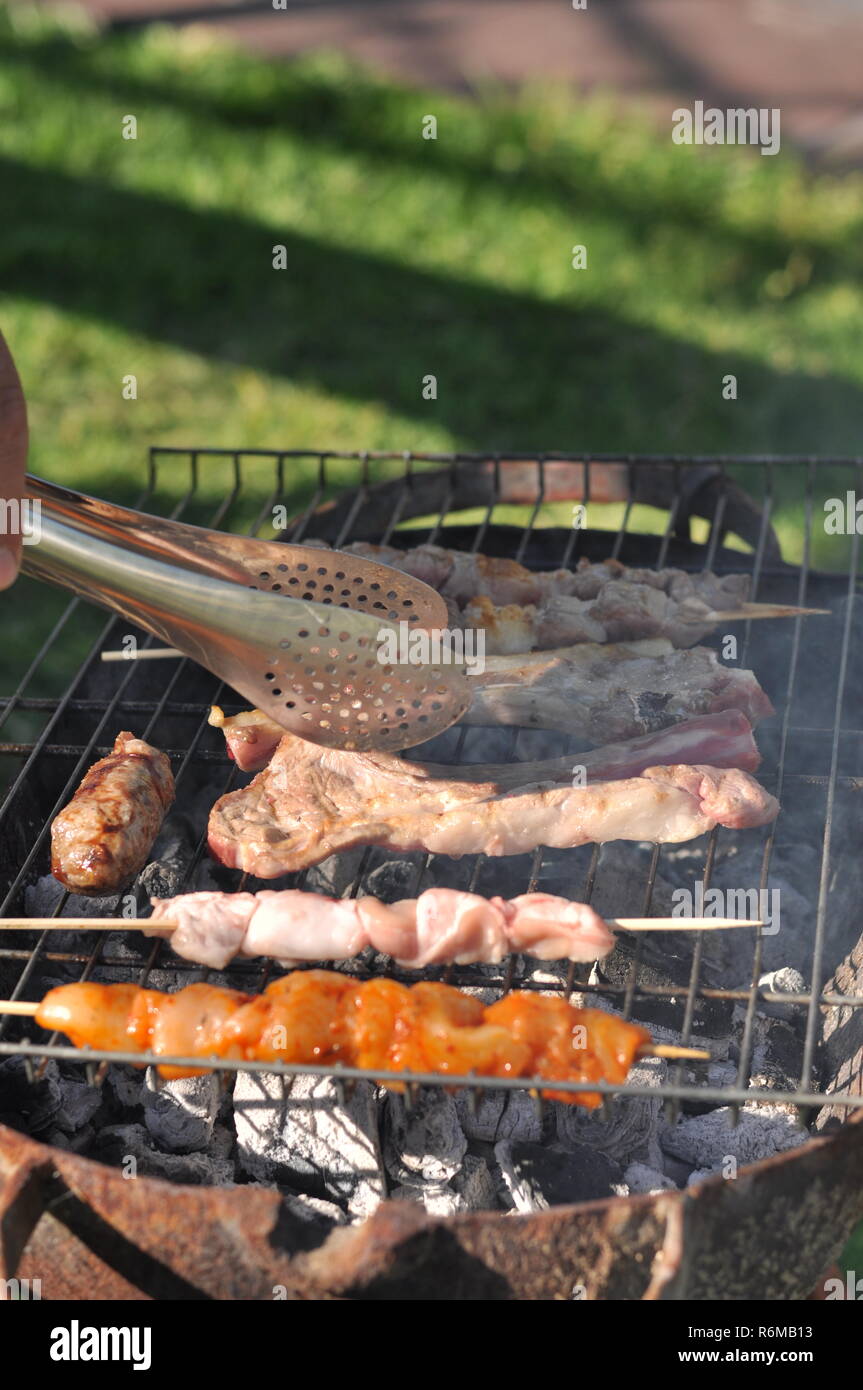 Traditional Cypriot meze and kebap barbecue party in the garden with ...