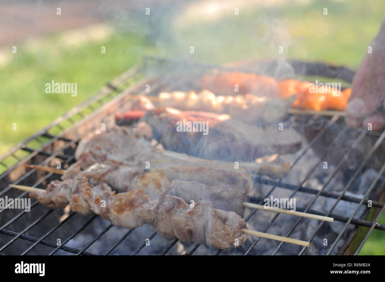 Traditional Cypriot meze and kebap barbecue party in the garden with ...