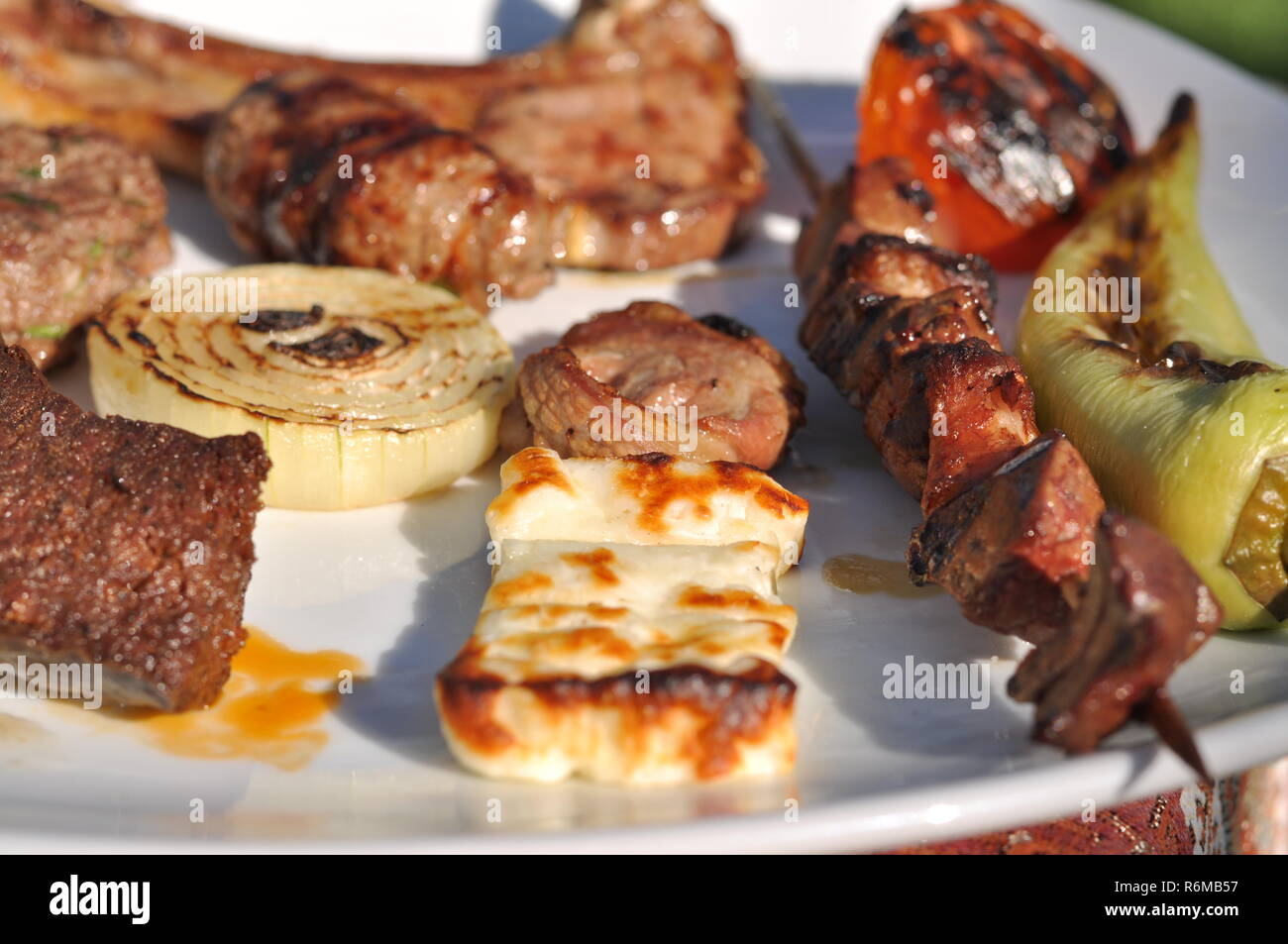 Traditional Cypriot meze and kebap barbecue party in the garden with ...