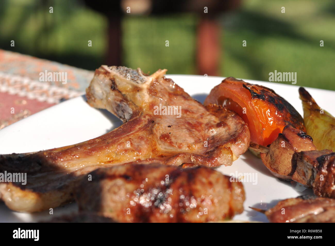 Traditional Cypriot meze and kebap barbecue party in the garden with ...