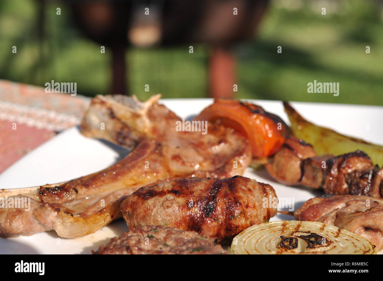 Traditional Cypriot meze and kebap barbecue party in the garden with ...