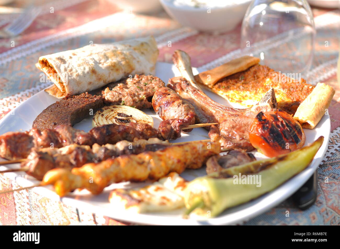 Traditional Cypriot meze and kebap barbecue party in the garden with ...