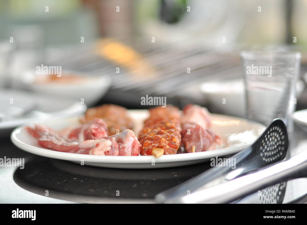 Traditional Cypriot meze and mix meat and chicken kebab table with ...