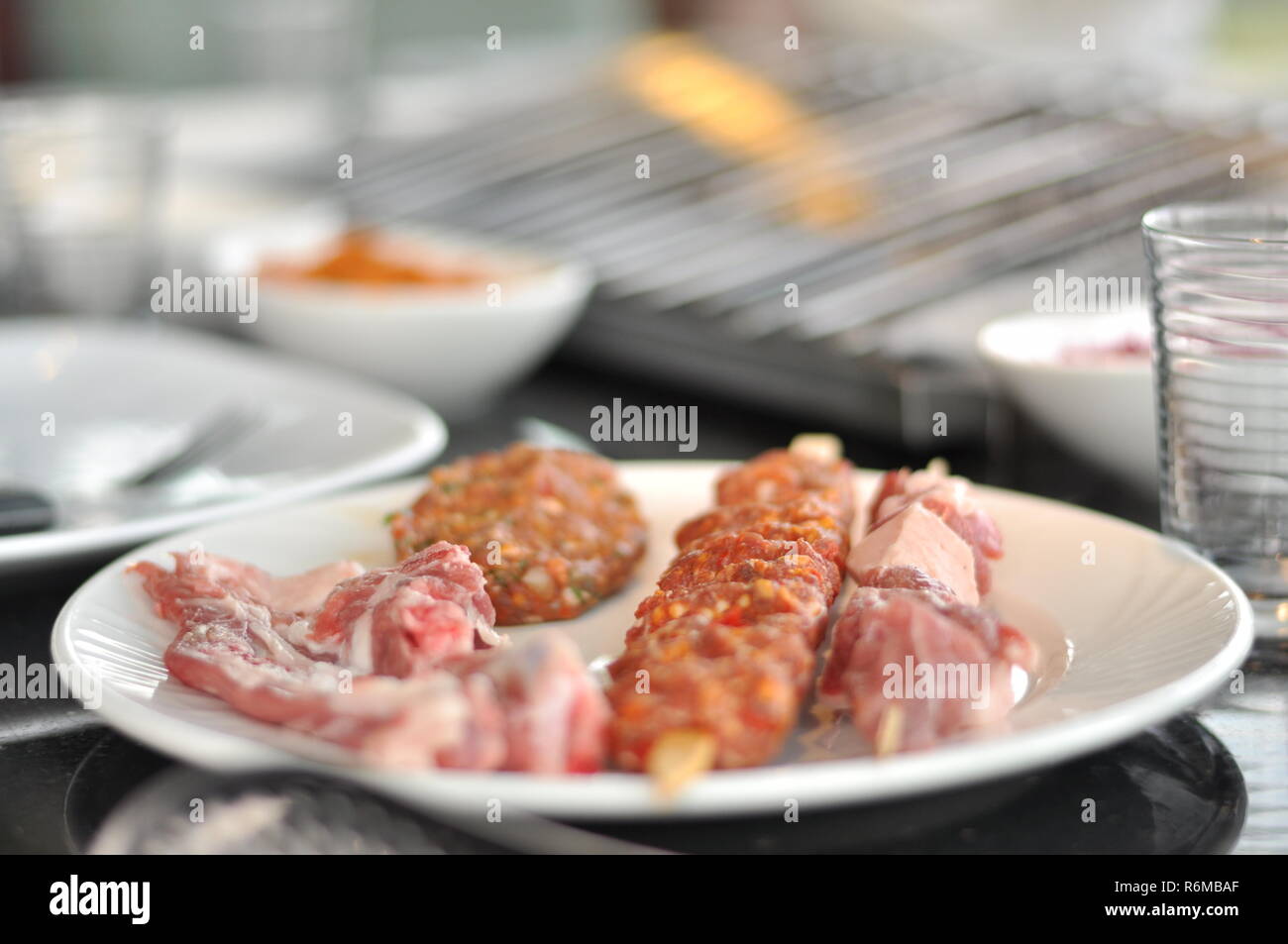 Traditional Cypriot meze and mix meat and chicken kebab table with ...
