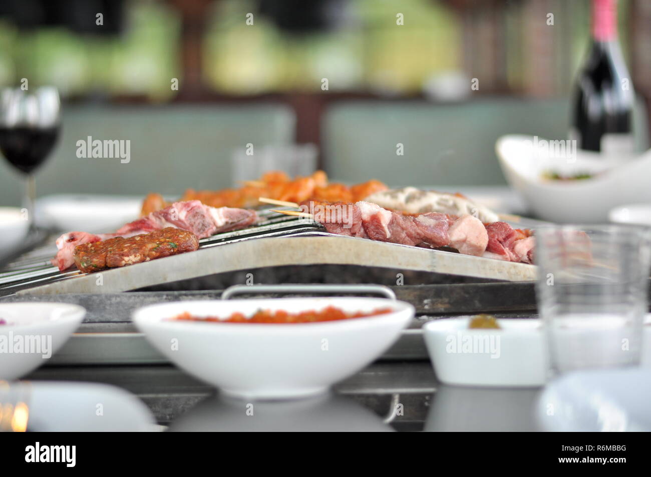 Traditional Cypriot meze and mix meat and chicken kebab table with ...
