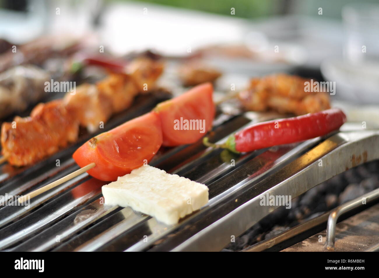 Traditional Cypriot meze and mix meat and chicken kebab table with ...
