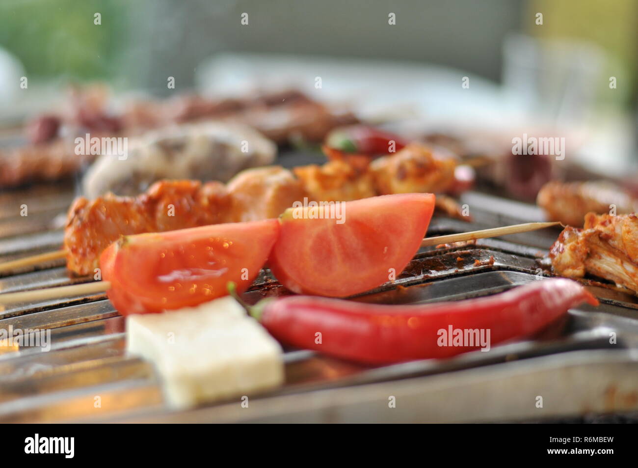 Traditional Cypriot meze and mix meat and chicken kebab table with ...