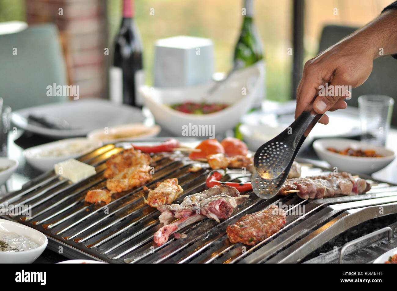 Traditional Cypriot meze and mix meat and chicken kebab table with ...