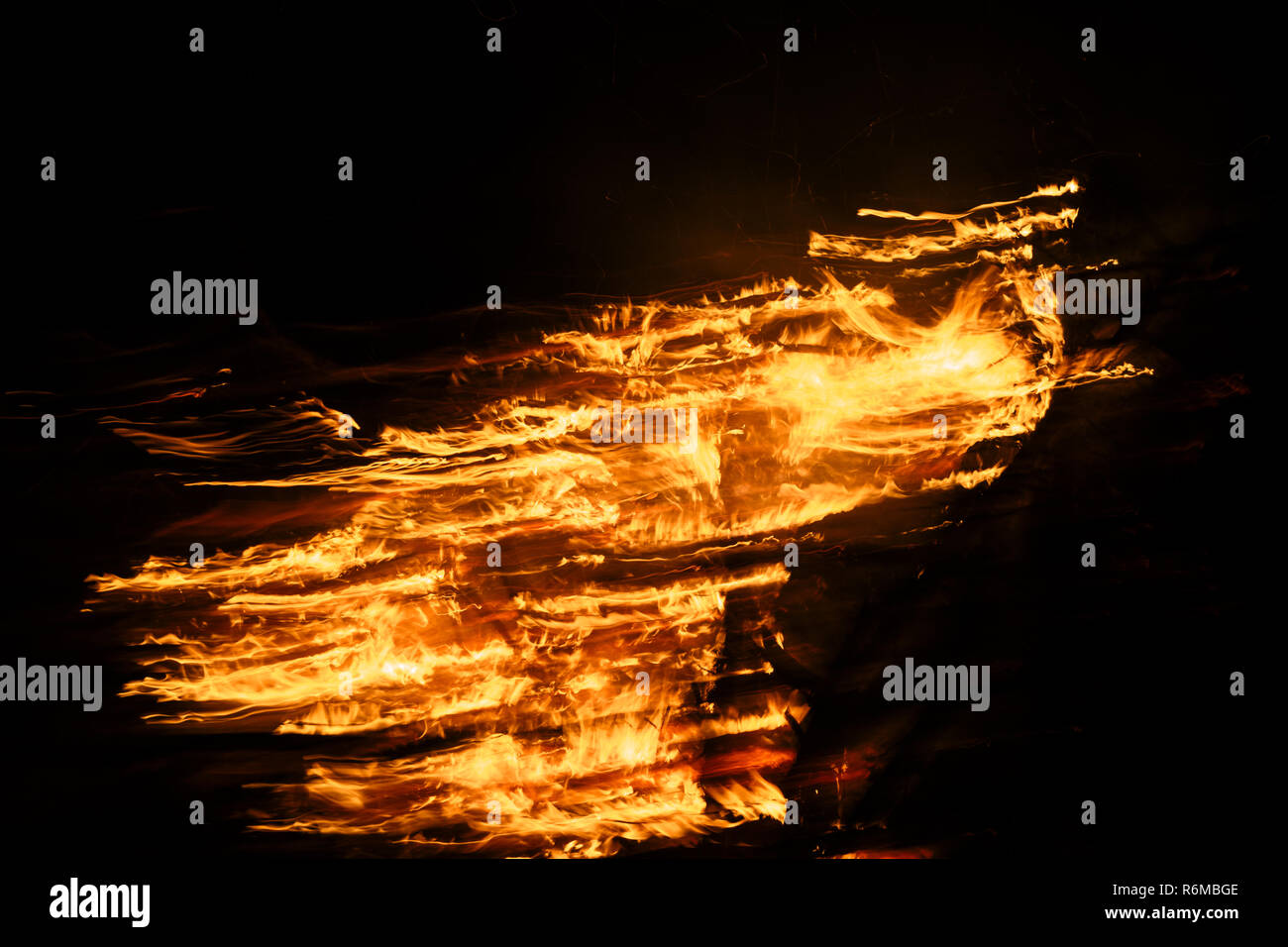 Slow motion slow shutter fire red orange black fire streaks hi-res ...