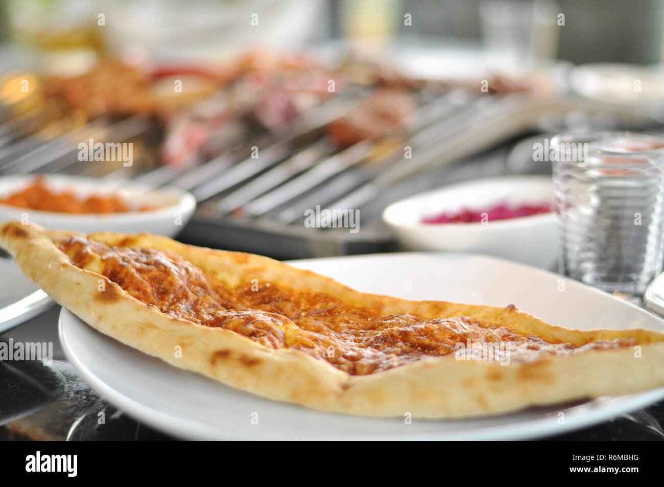 Traditional Cypriot meze and mix meat and chicken kebab table with ...