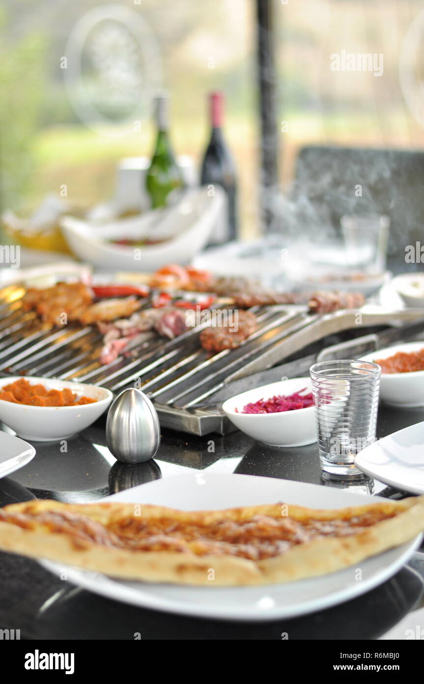 Traditional Cypriot meze and mix meat and chicken kebab table with ...