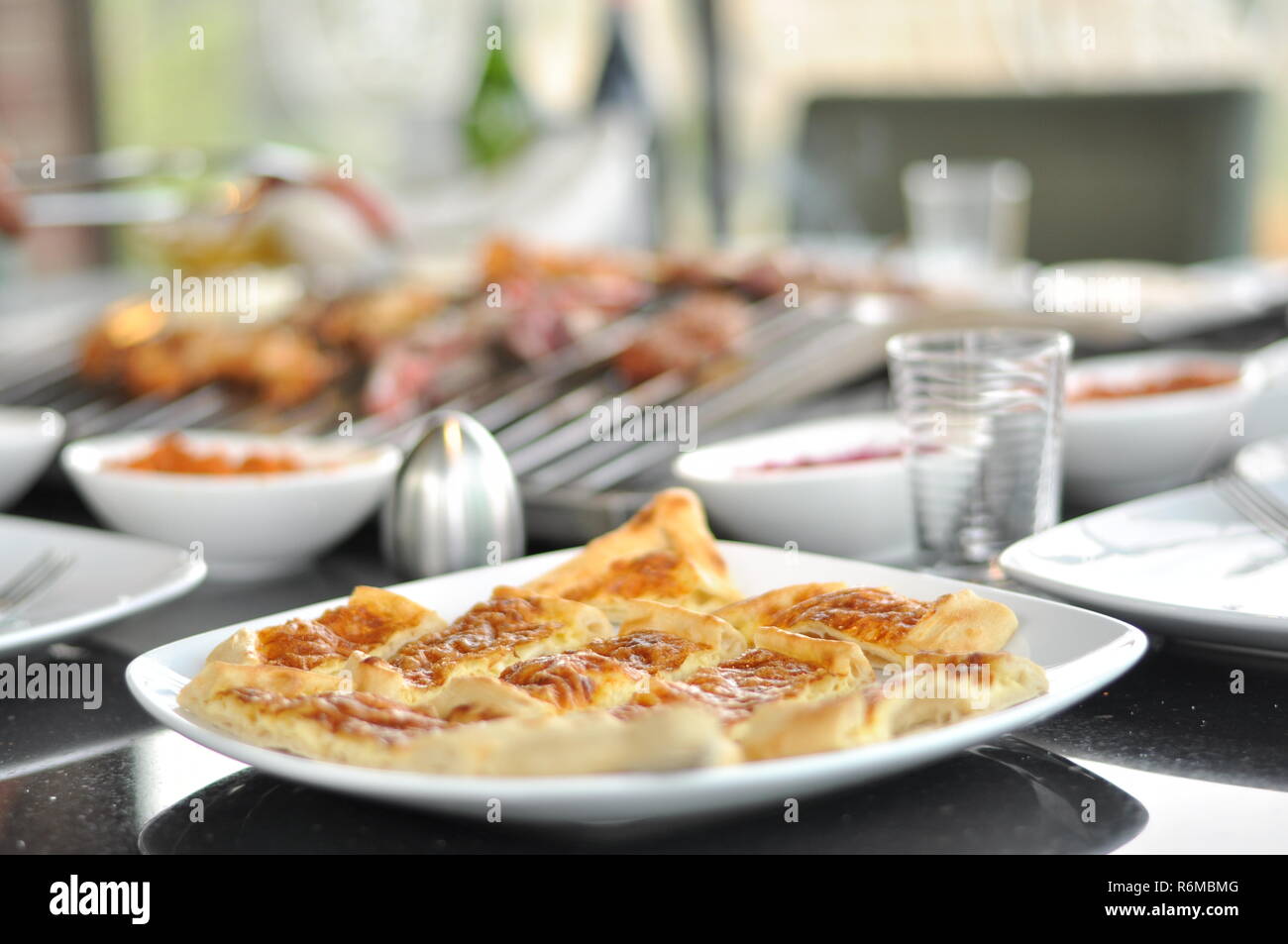 Traditional Cypriot meze and mix meat and chicken kebab table with ...