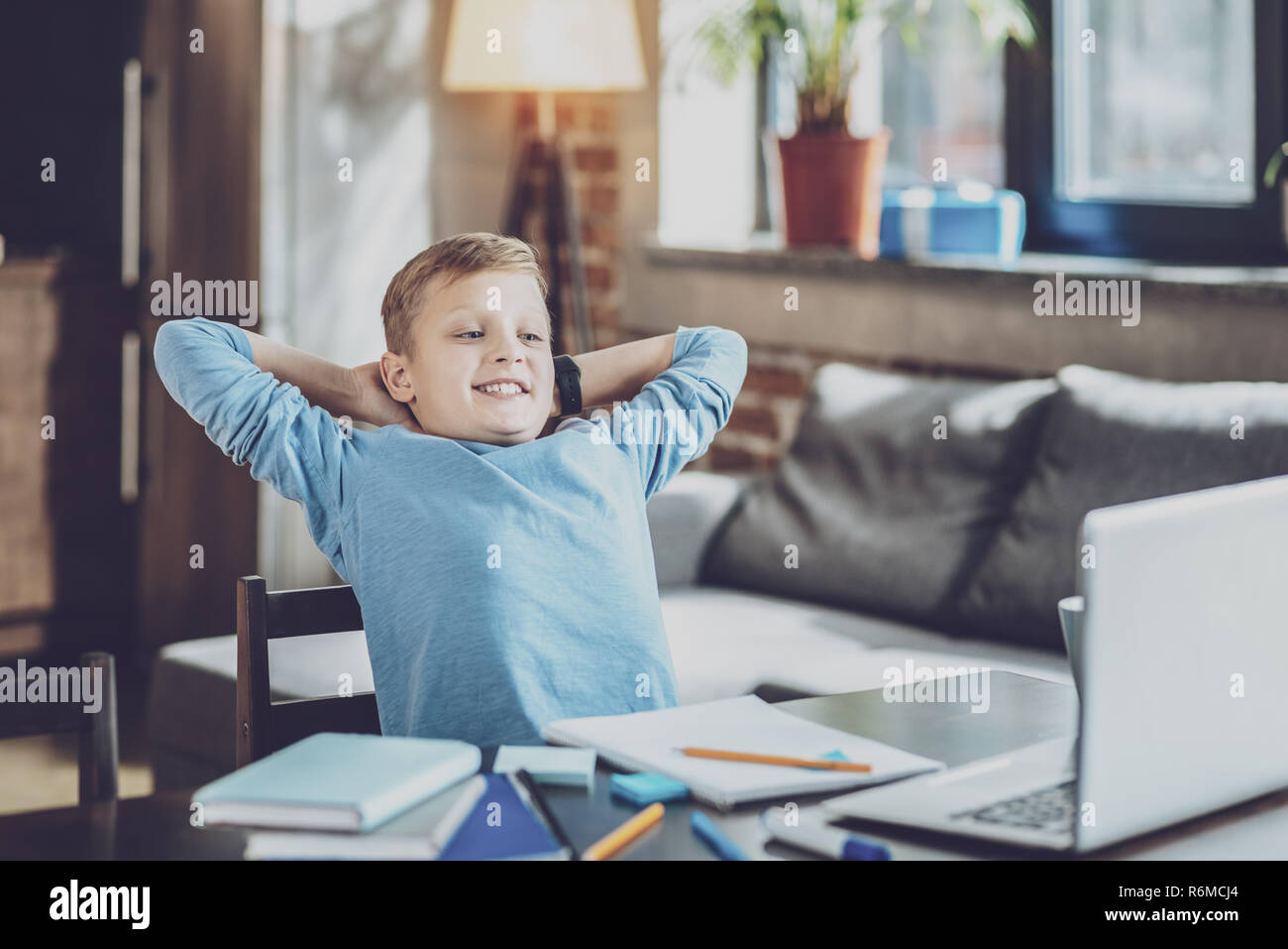 Positive delighted kid having pause Stock Photo - Alamy