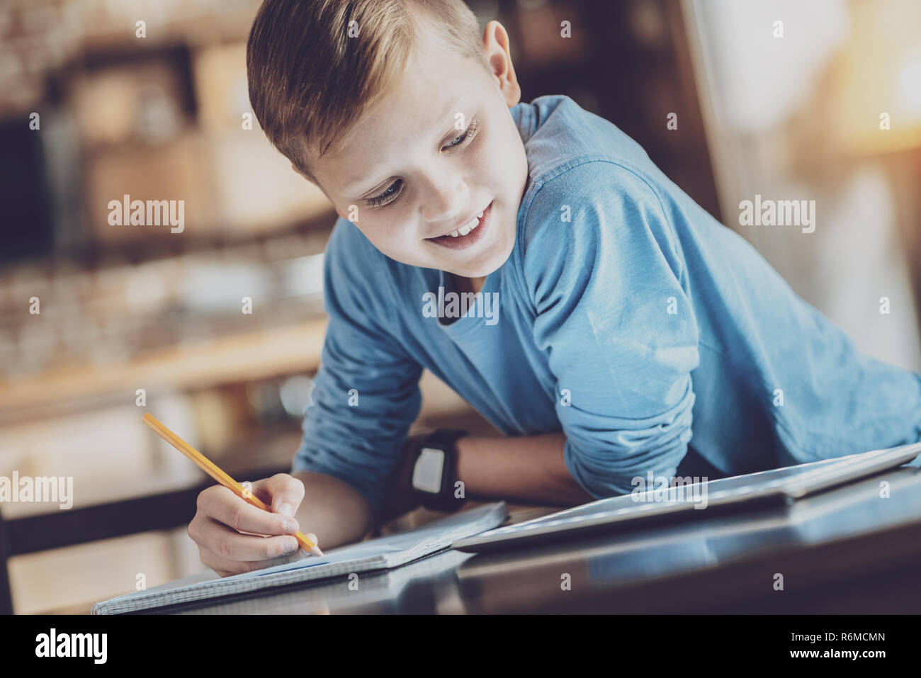 Close up of cheerful boy that drawing picture Stock Photo - Alamy