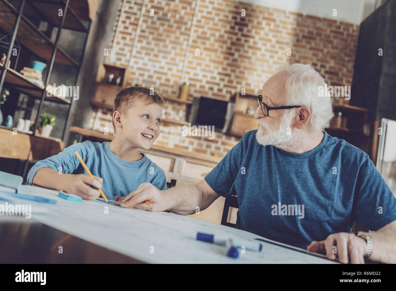 Child helping elderly hi-res stock photography and images - Alamy