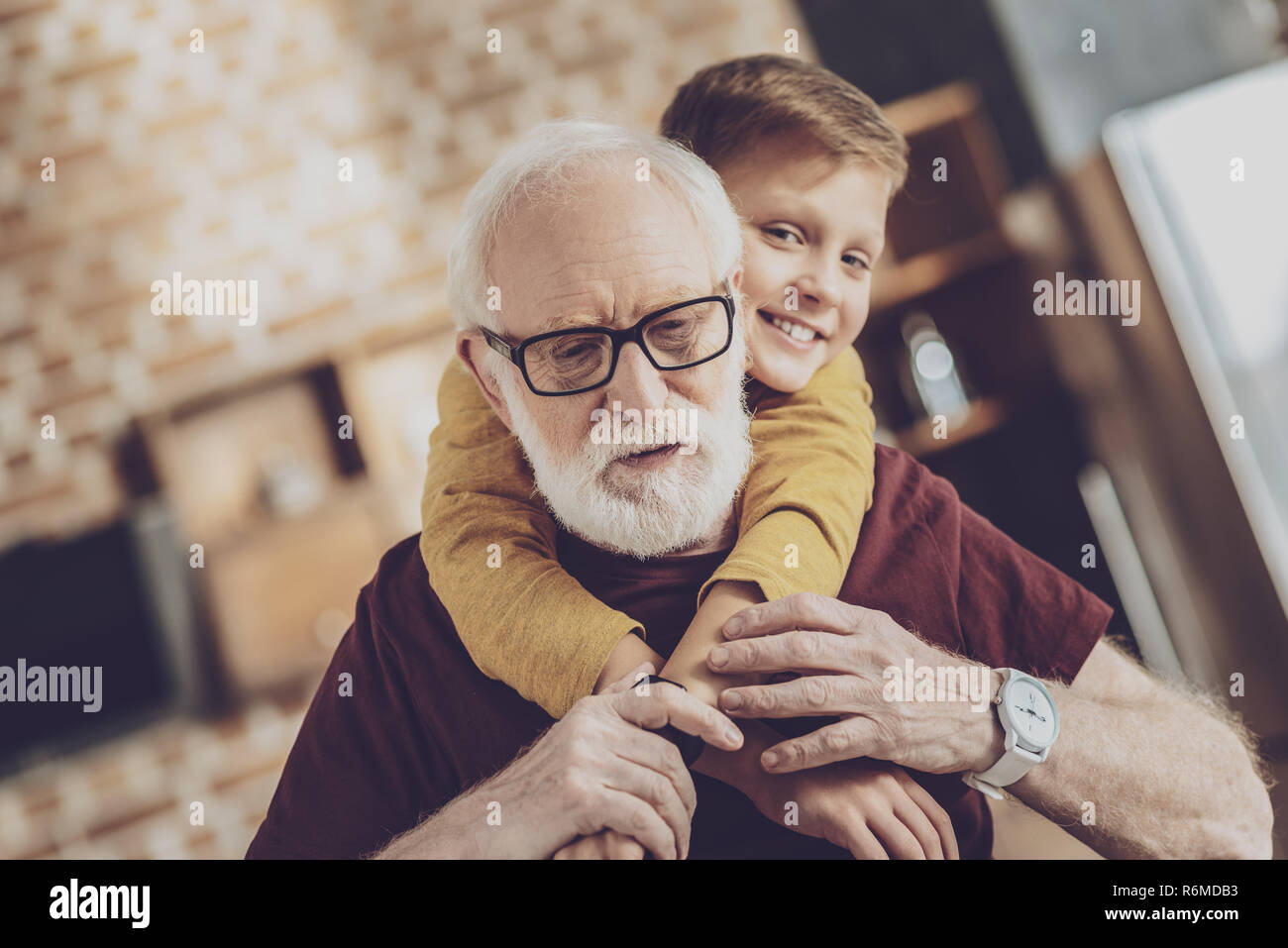 Concentrated male person looking downwards Stock Photo - Alamy